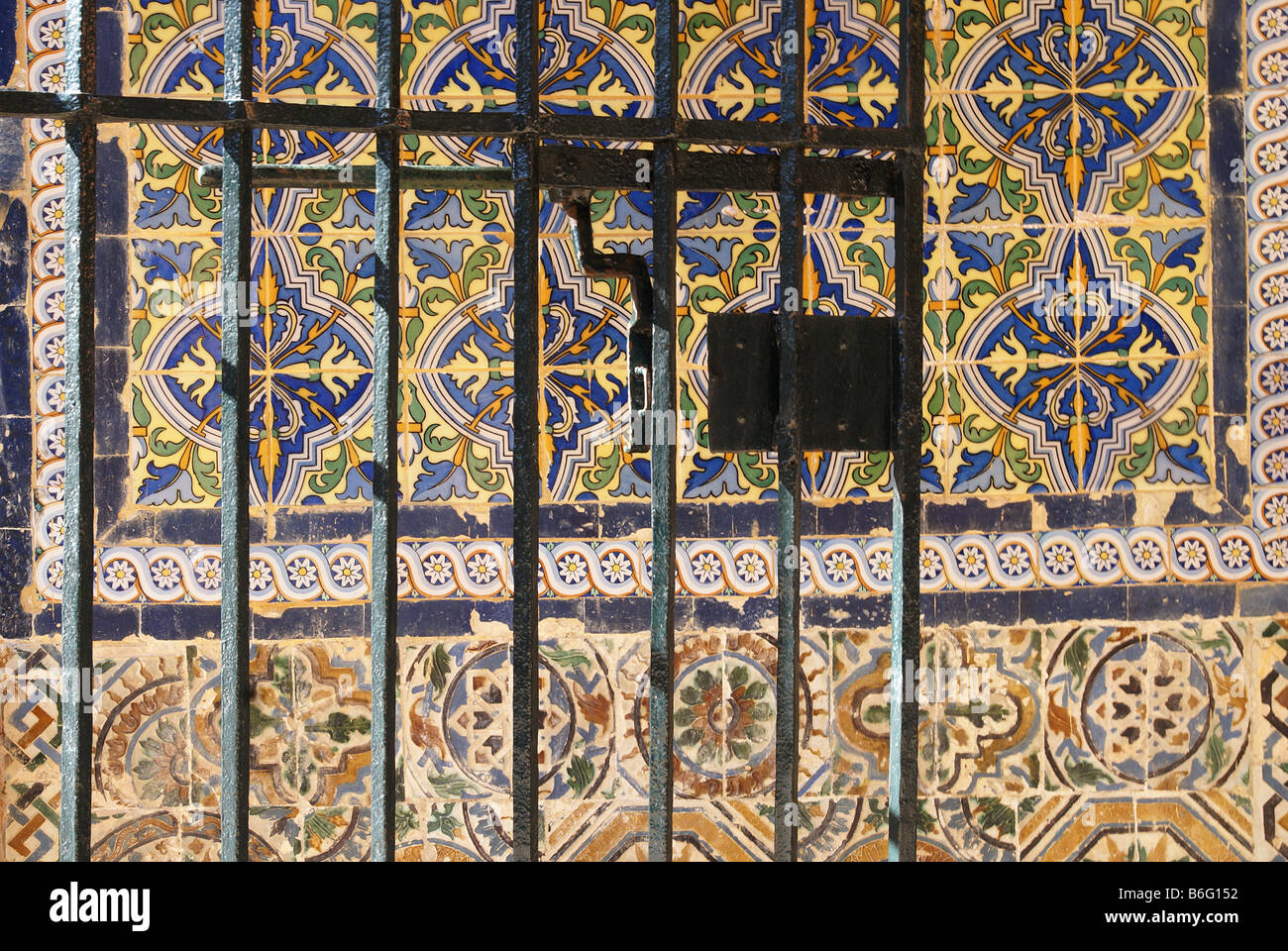 details of a metal gate and wall tiles in spain Stock Photo - Alamy