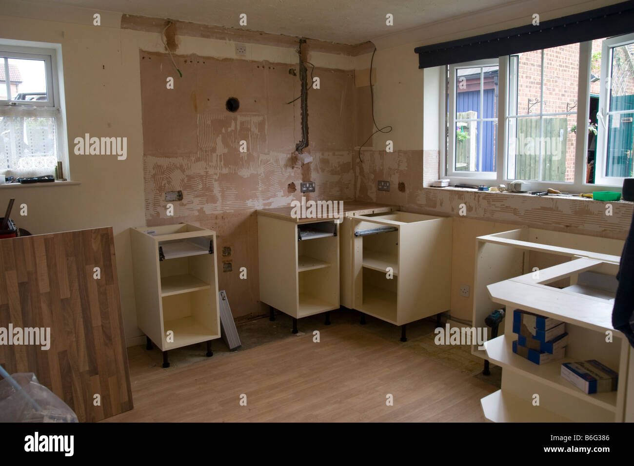 New Kitchen being installed in Modern British House Stock Photo - Alamy