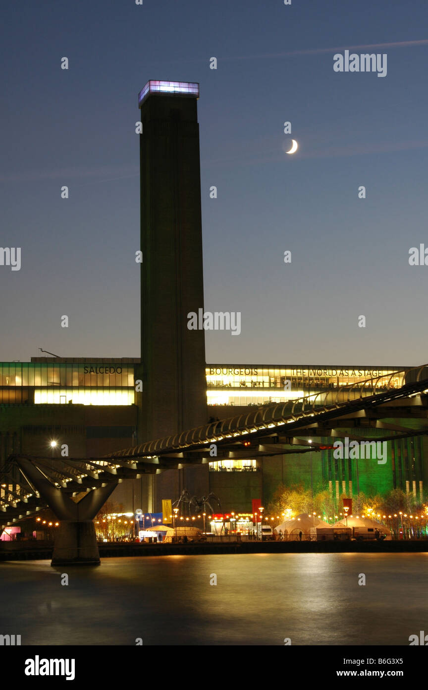 The Tate Modern gallery with Millenium Bridge at night, London, UK ...