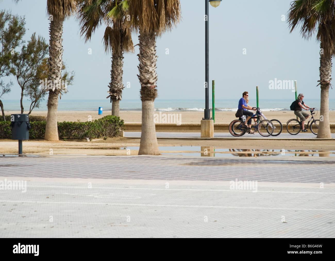 Bike riders on the beachfront in Valencia, Spain Stock Photo - Alamy
