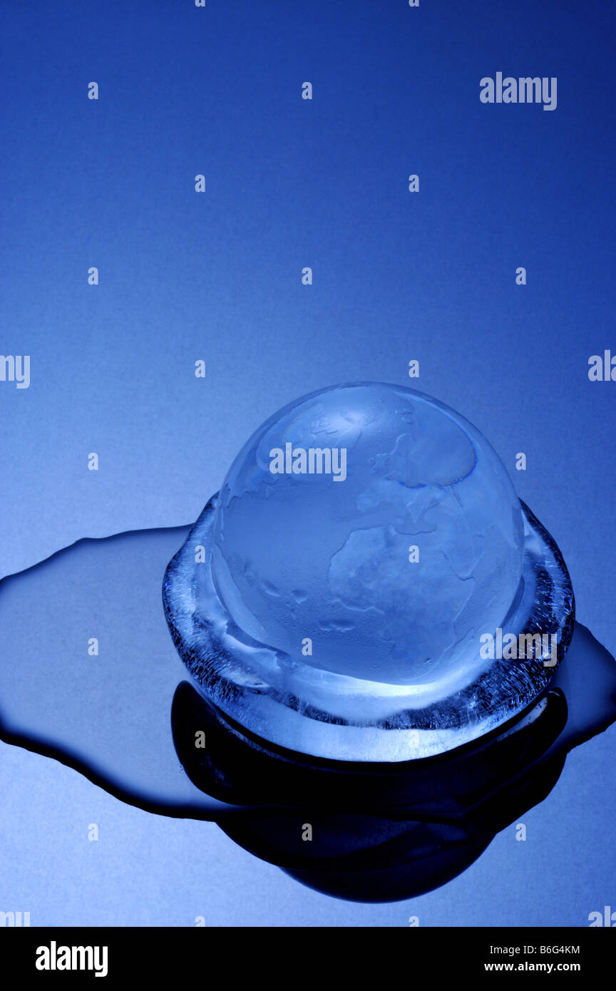 Small glass globe sitting in a melting ice cube Stock Photo - Alamy