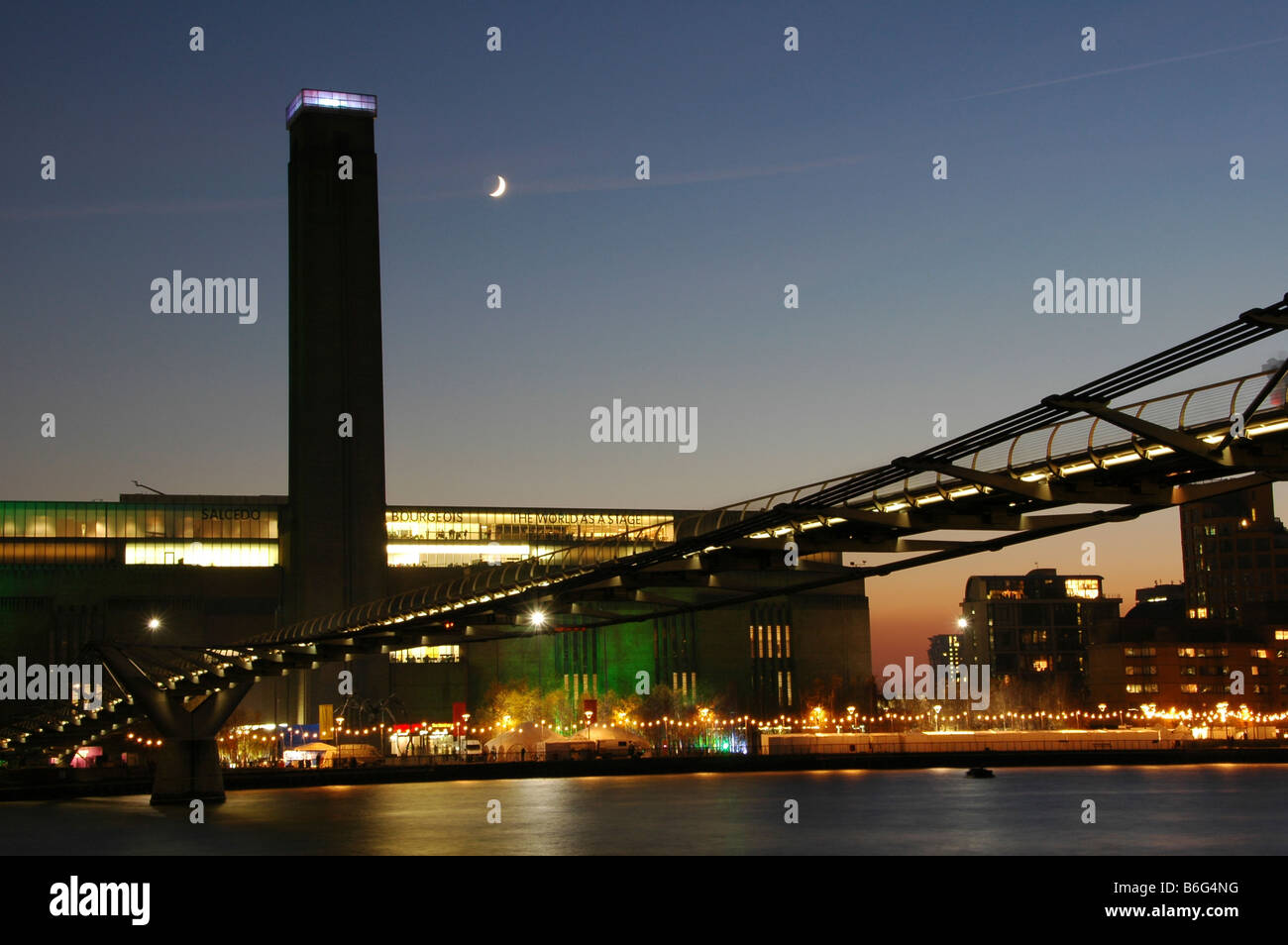 The Tate Modern gallery with Millenium Bridge at night, London, UK ...
