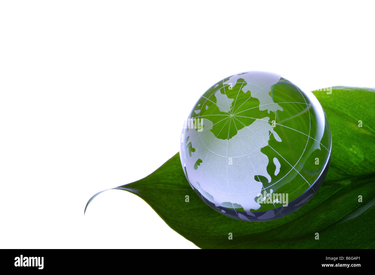 Glass globe on green hi-res stock photography and images - Alamy