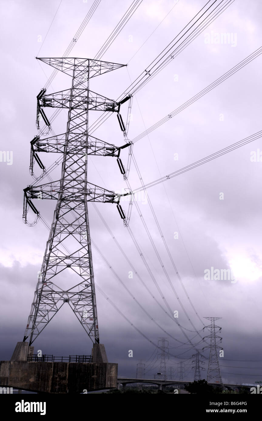 Electricity pylon connected to other pylons Stock Photo - Alamy