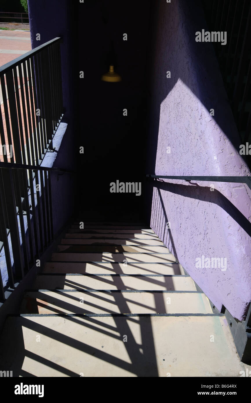 Stairway in a purple building with harsh shadows Stock Photo - Alamy