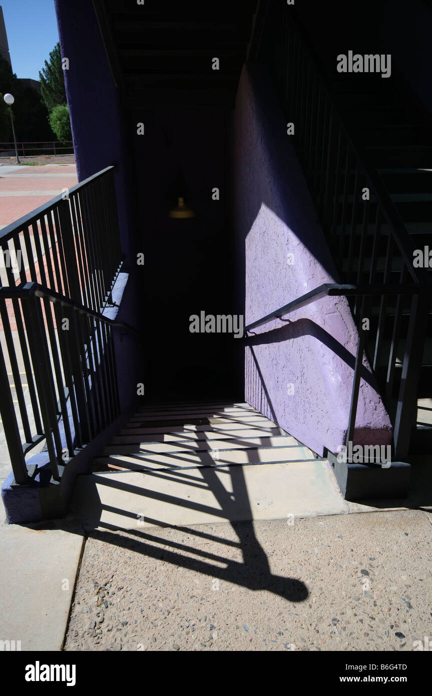 Stairway in a purple building with harsh shadows Stock Photo - Alamy