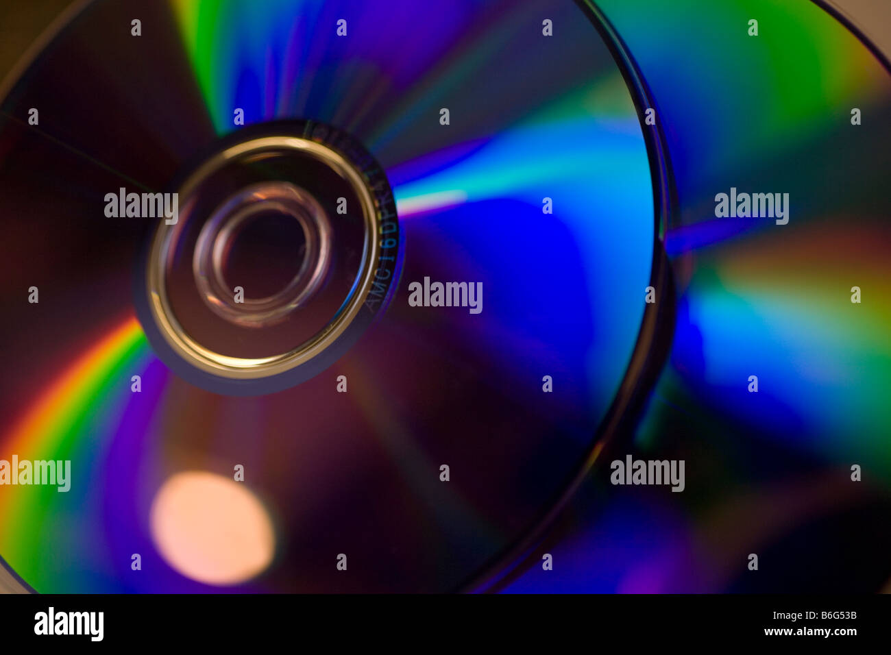 light reflecting from the mirror surface of compact discs Stock Photo ...