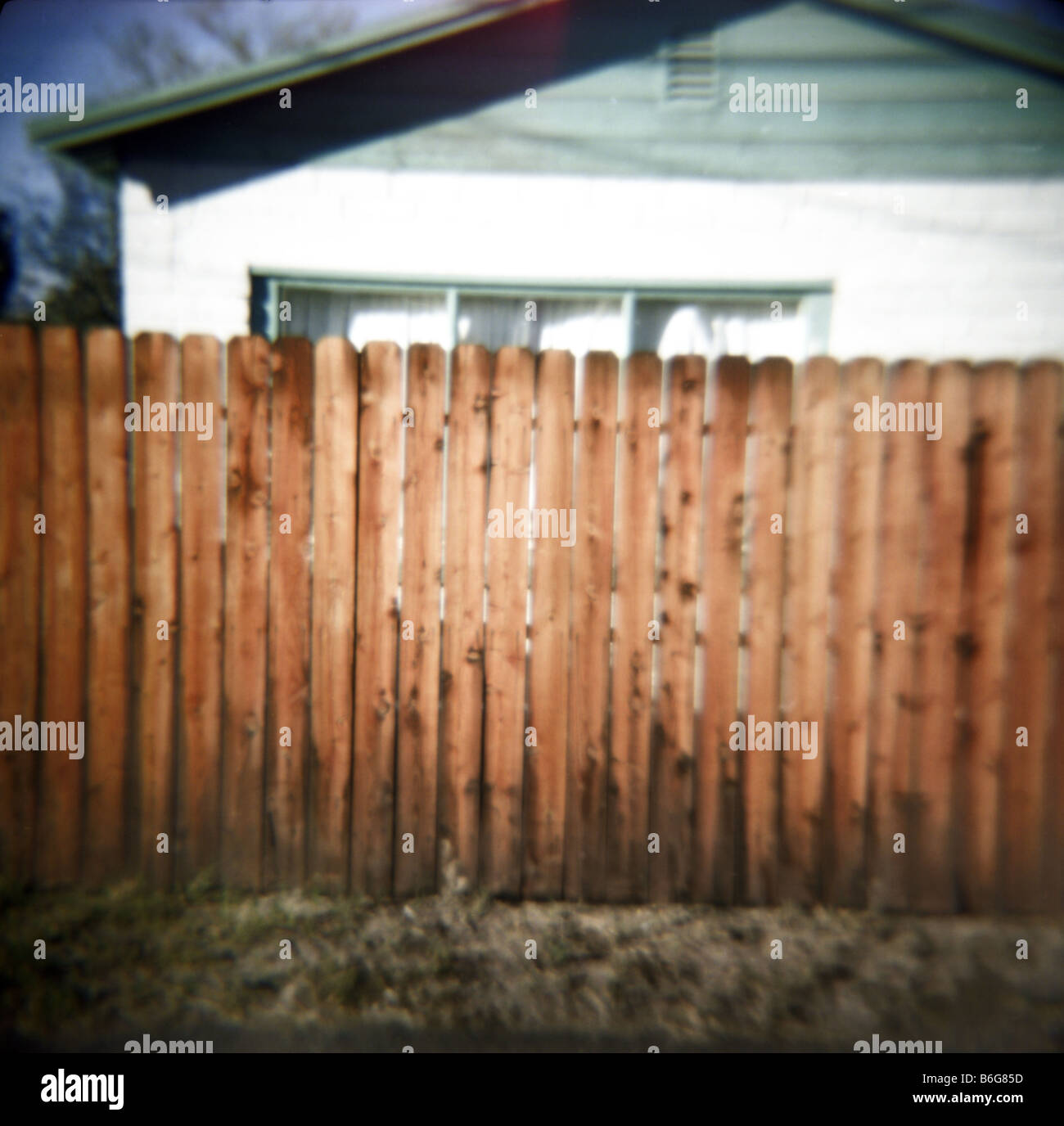 bungalow little house fence gate privacy hidden Stock Photo - Alamy