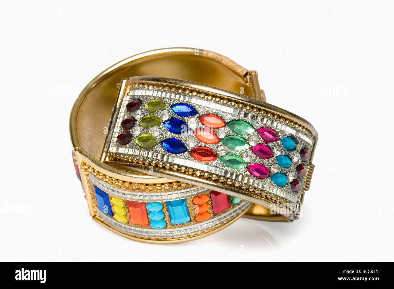 Gold bangles bracelets Cut Out Stock Images & Pictures - Alamy