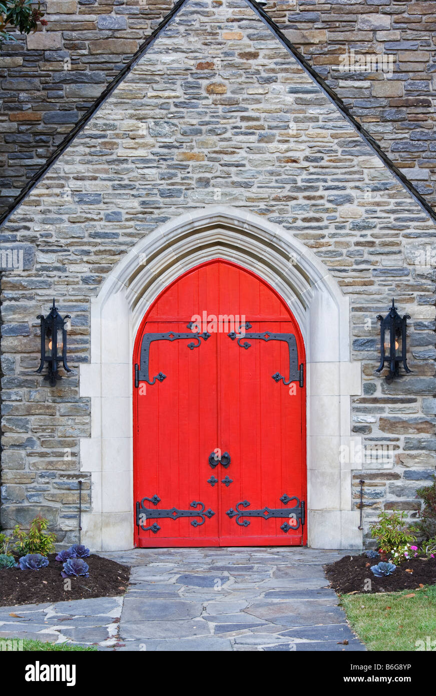 Red church doors on a old stone church Stock Photo - Alamy