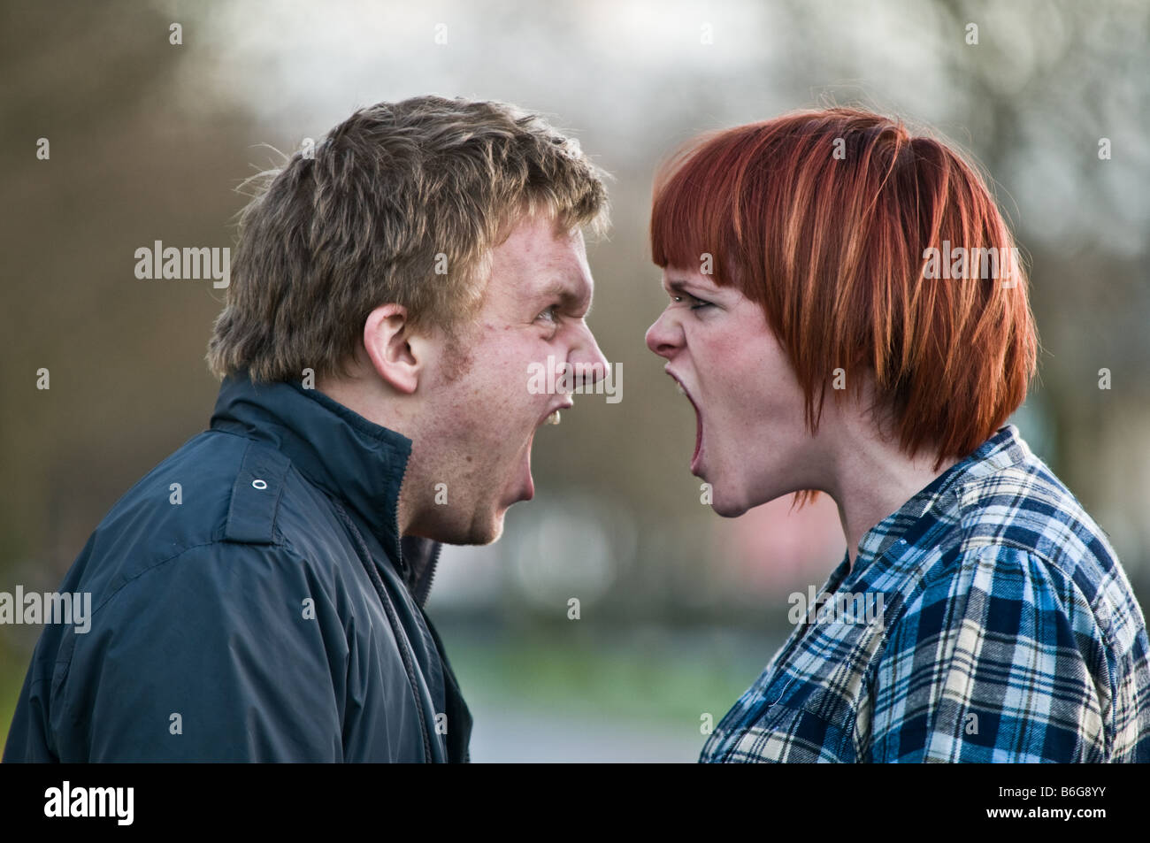 young british english couple man and woman having a full on blazing row ...