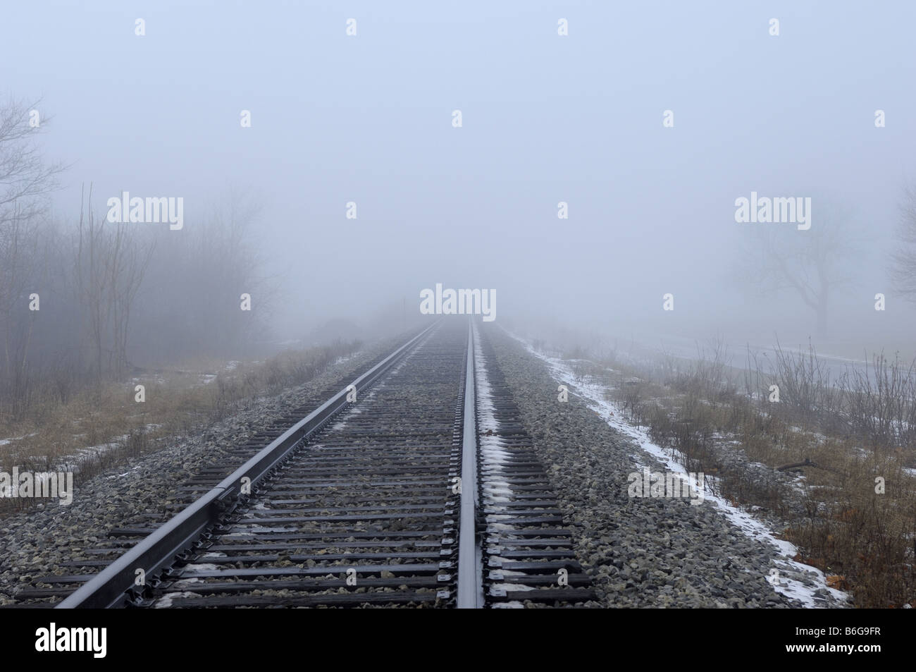 Railroad tracks in a winter fog Stock Photo - Alamy