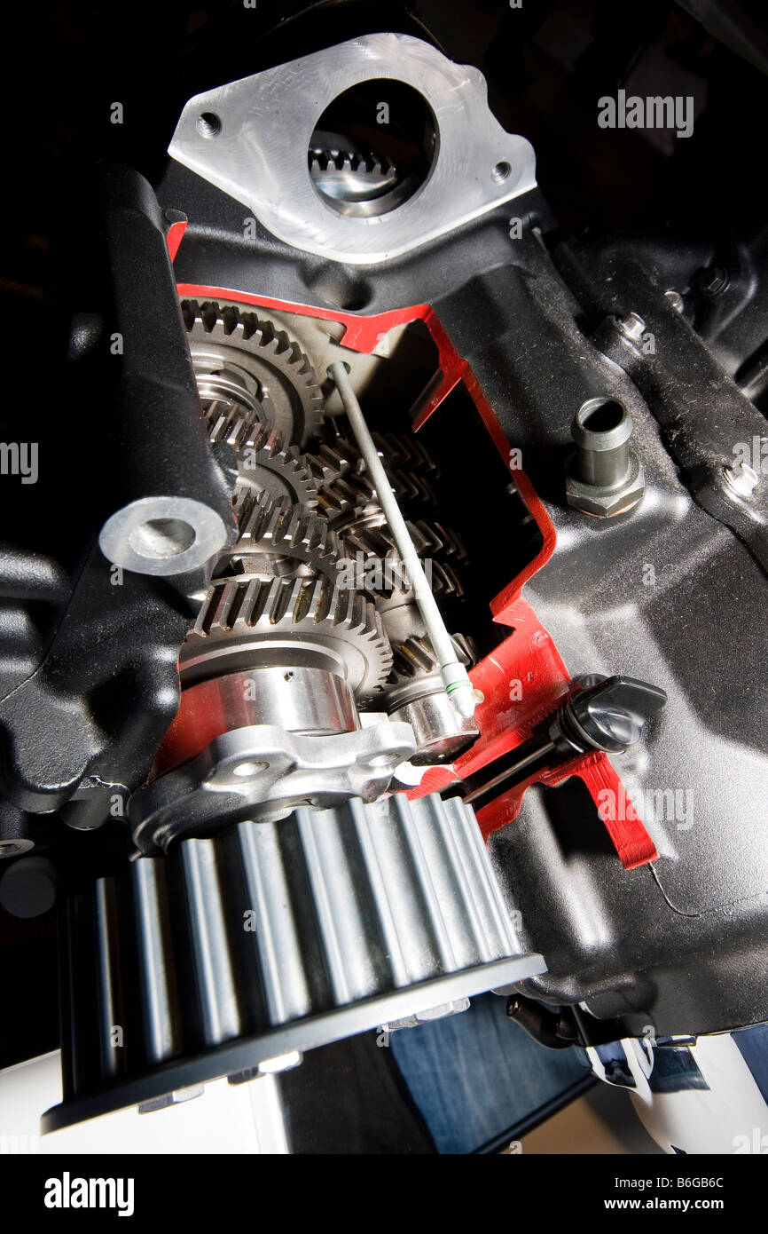 Close up of gear wheels in cut away section of modern motor cycle ...