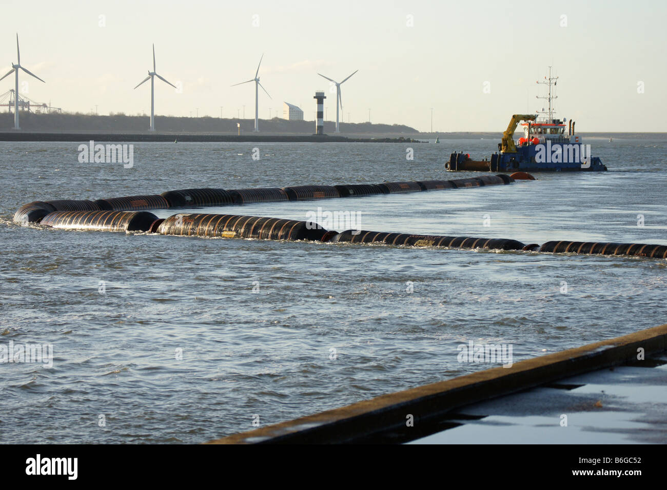 Floating pipeline ship sea surface wind turbine in Europoort port ...