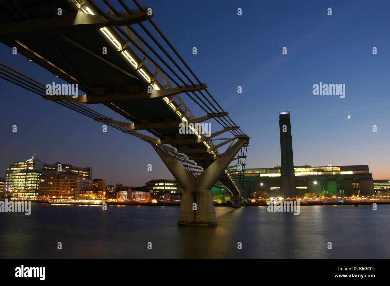 The Tate Modern gallery with Millenium Bridge at night, London, UK ...