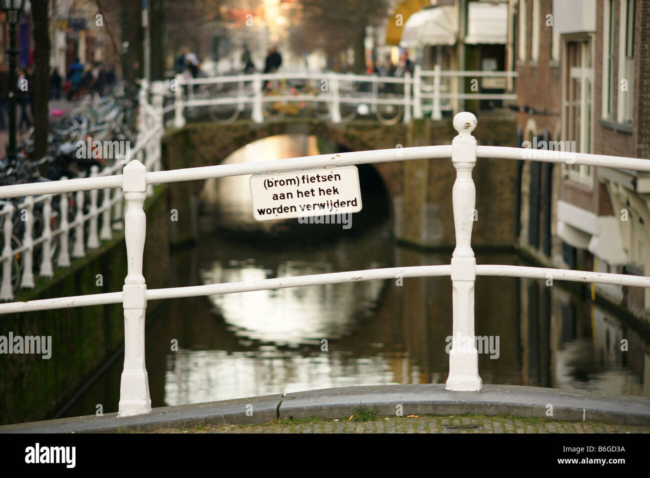 Old arc bridge above water channel in old Delft town autumn Netherlands ...