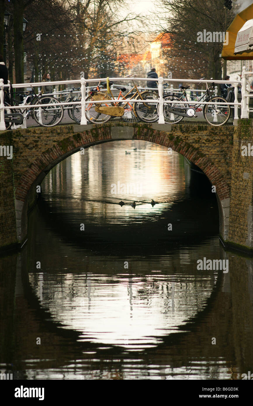Old arc bridge above water channel in old Delft town autumn Netherlands ...