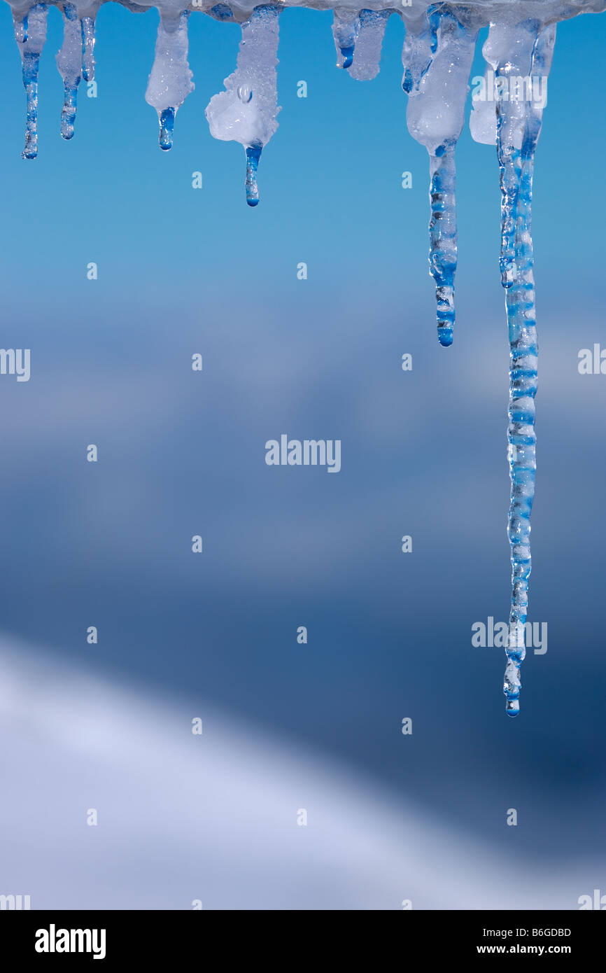 Melting ice with mountains on the background Stock Photo - Alamy