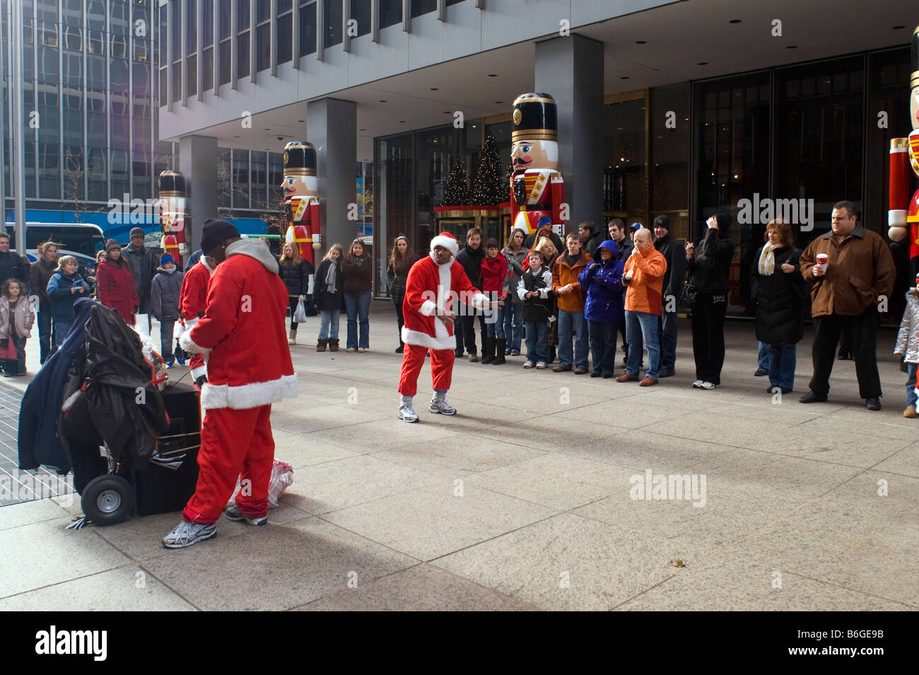 Street performers dressed as Santa Claus on Sixth Avenue in New York on ...