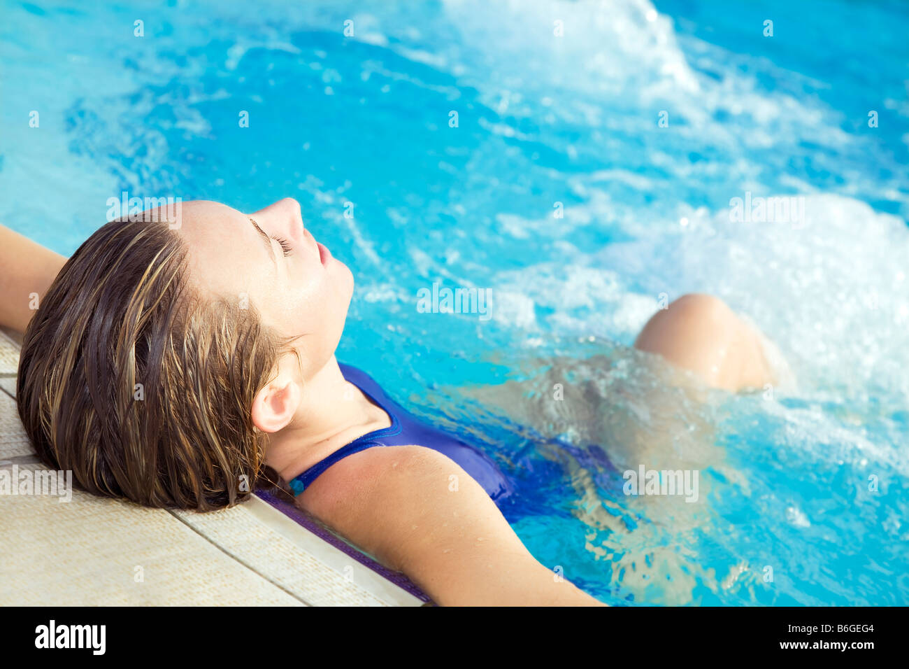 Portrait of young woman sitting in swimming pool Stock Photo - Alamy