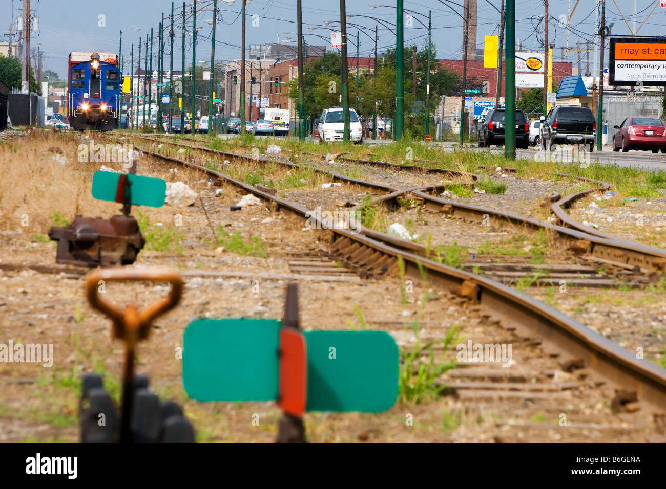 A small freight train makes it's way slowly down old tracks in Chicago ...