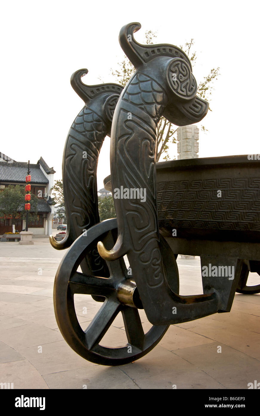 Larger than life size replica of a bronze wheeled two dragon serving ...