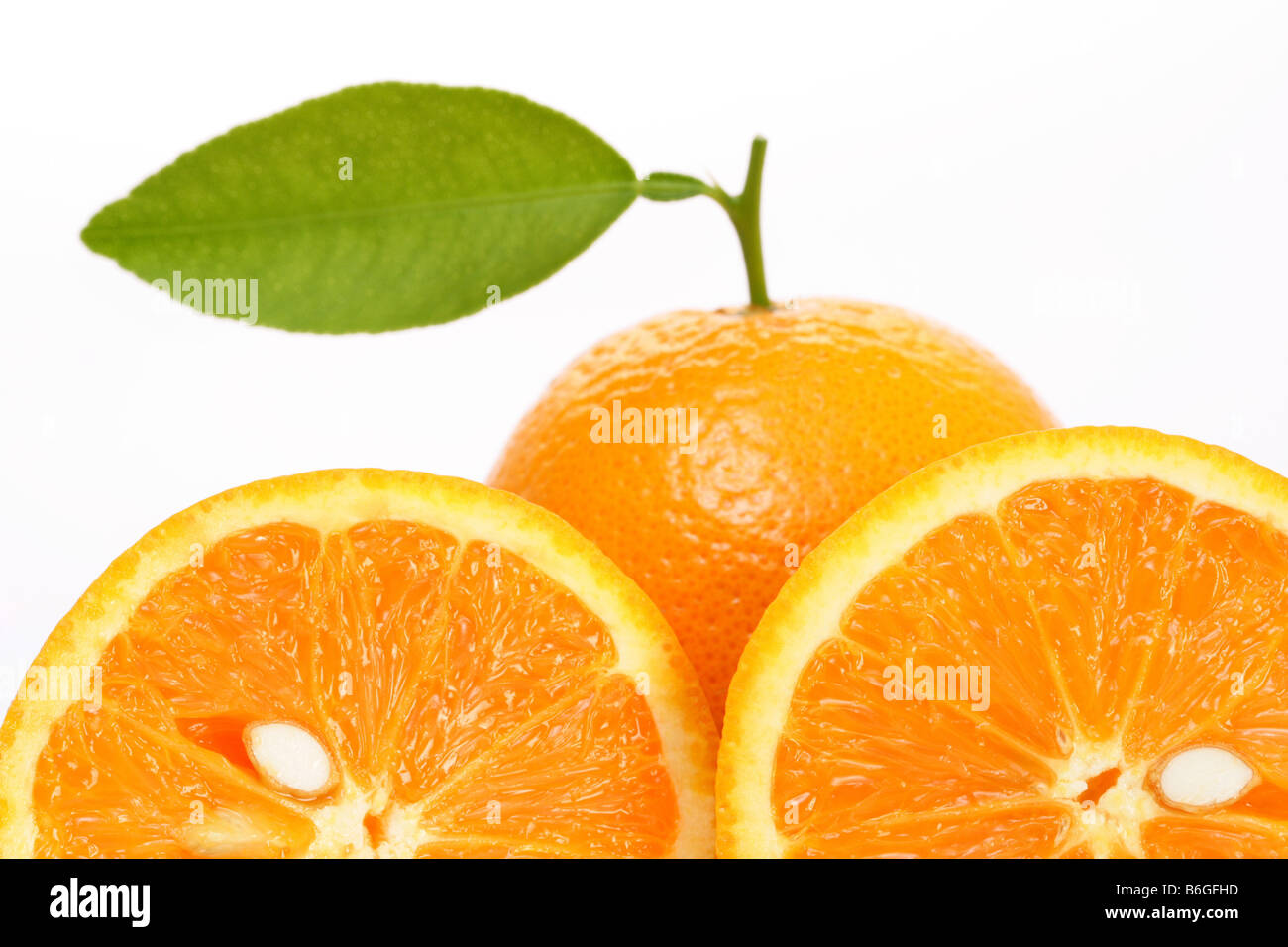 Fresh oranges on white Stock Photo - Alamy
