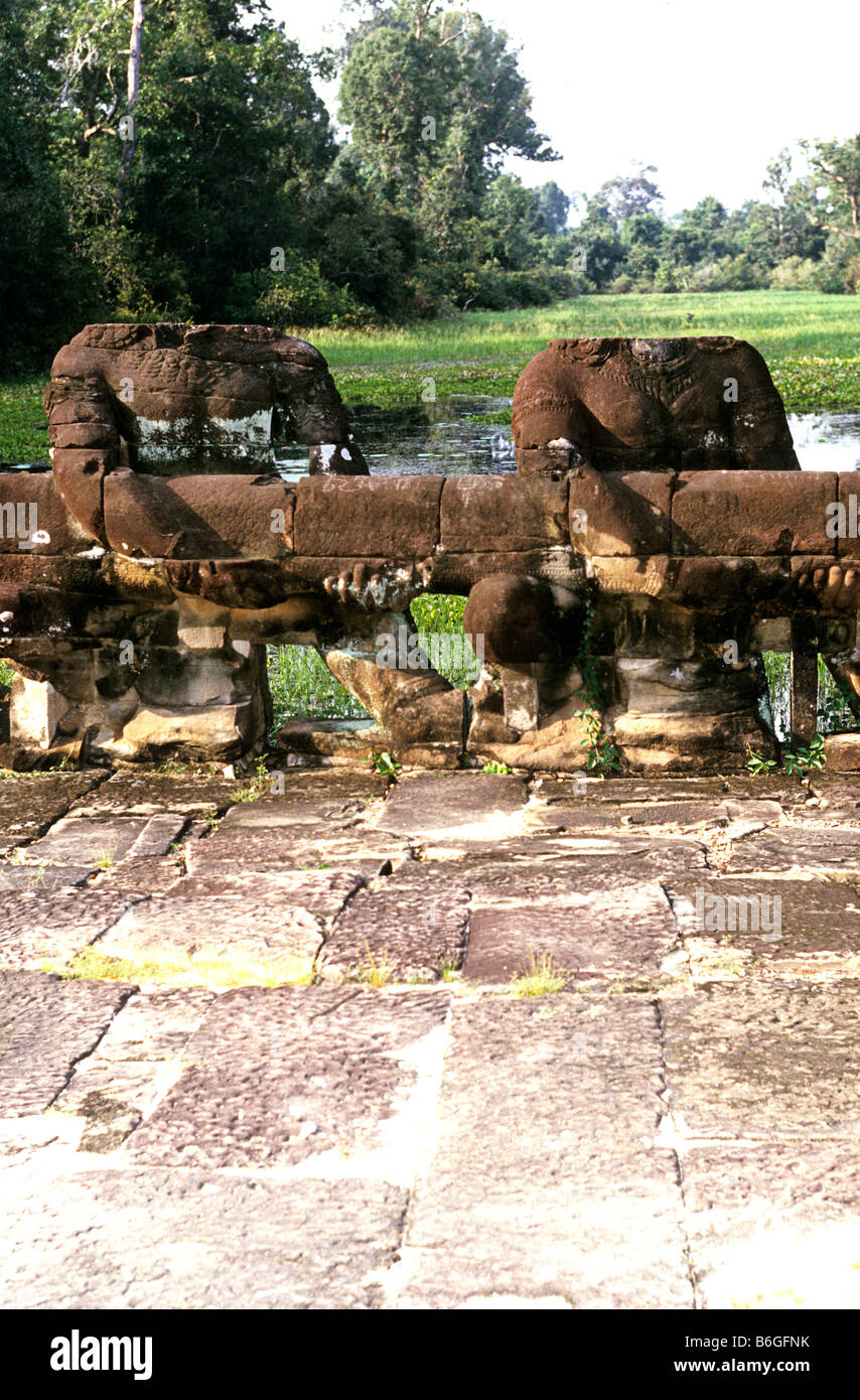 Naga statues on the Victory Gate- South entrance to the ruined city of ...