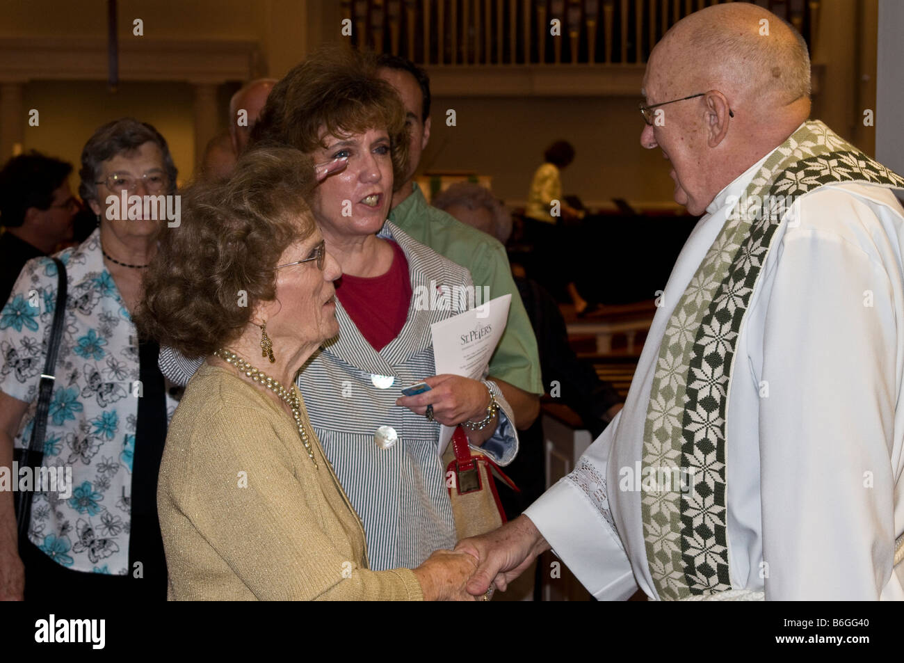 pastor greet worshipers following Sunday morning church service Stock ...