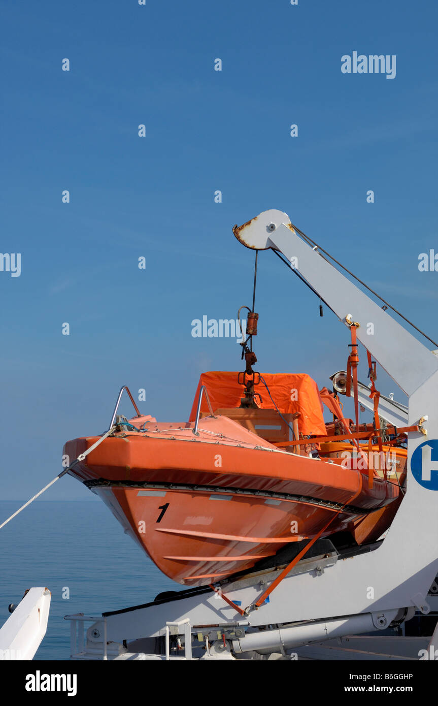 Orange shipboard lifeboat Stock Photo - Alamy