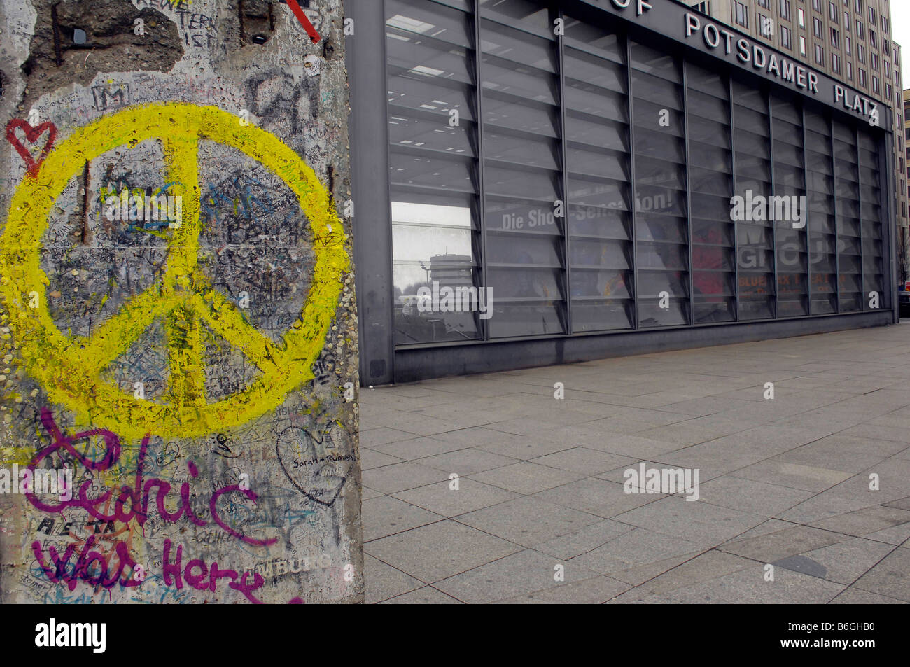 yellow peace sign berlin wall chewing gum Stock Photo - Alamy