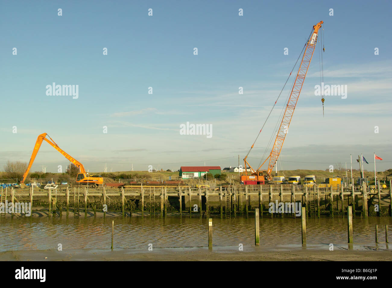 orange crane tall jetty facilities construction building river rother ...