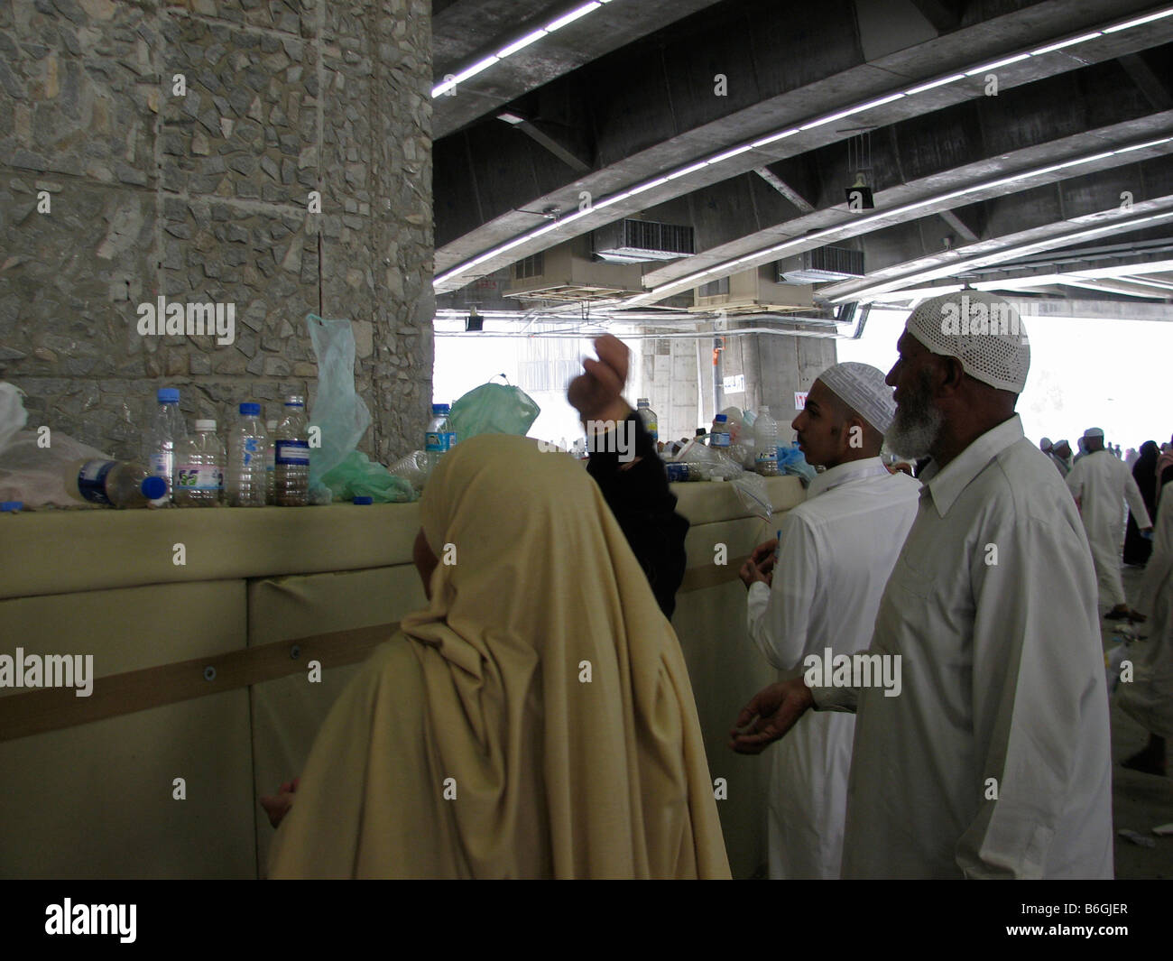 Pilgrims stoning one of the three pillars that symbolices the devil ...