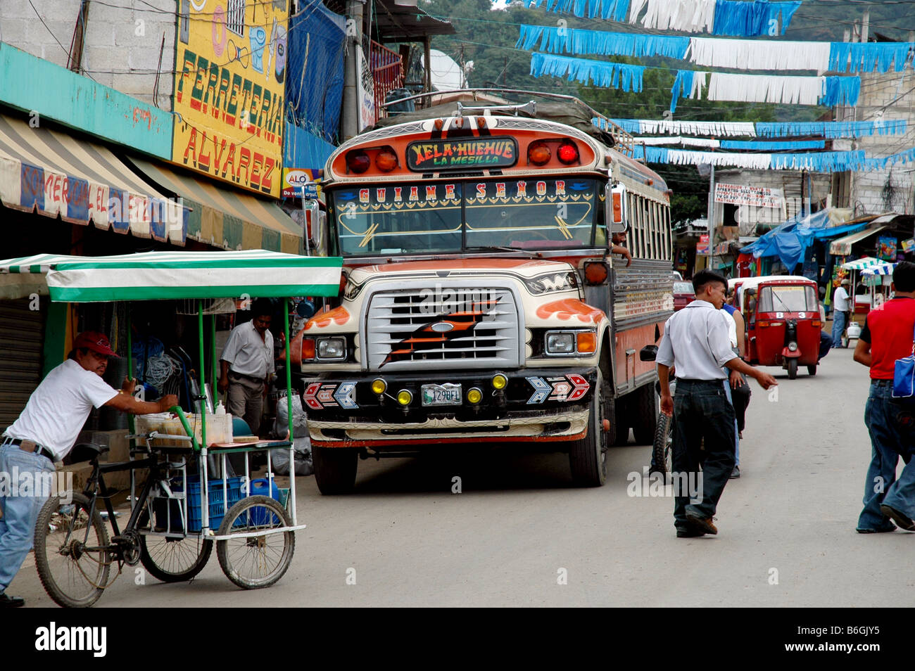 Street scene with chicken bus and street vendor, Honduras Stock Photo ...