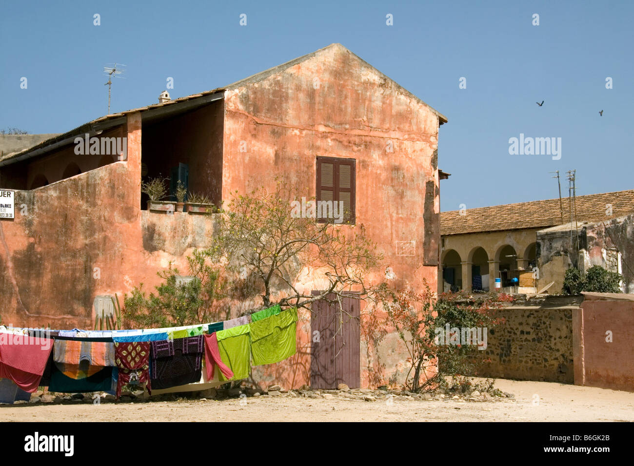 Colonial era houses on Gorée Island Dakar Senegal with plants and ...
