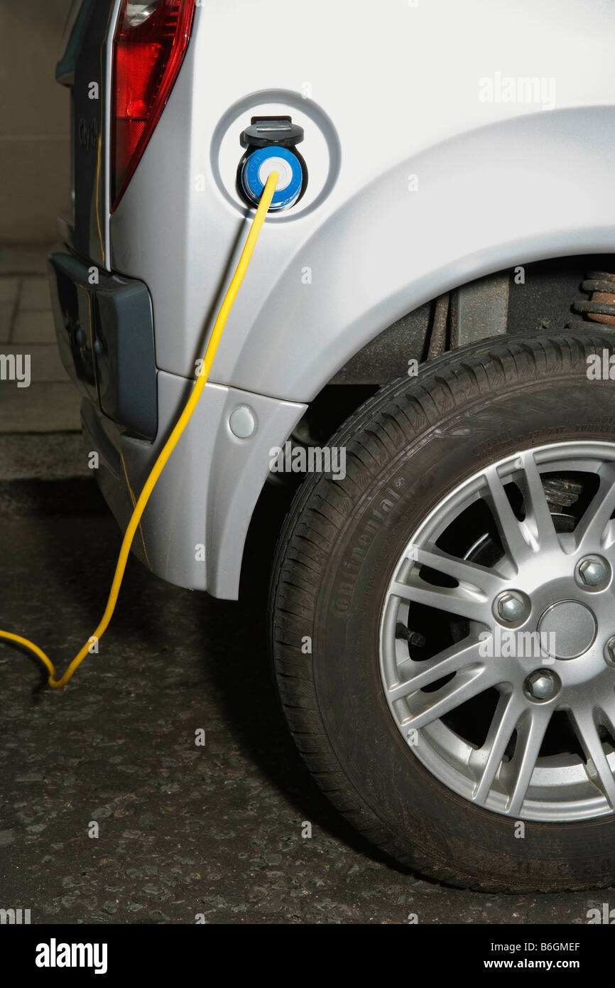 Electric cable attached to electric car Stock Photo - Alamy