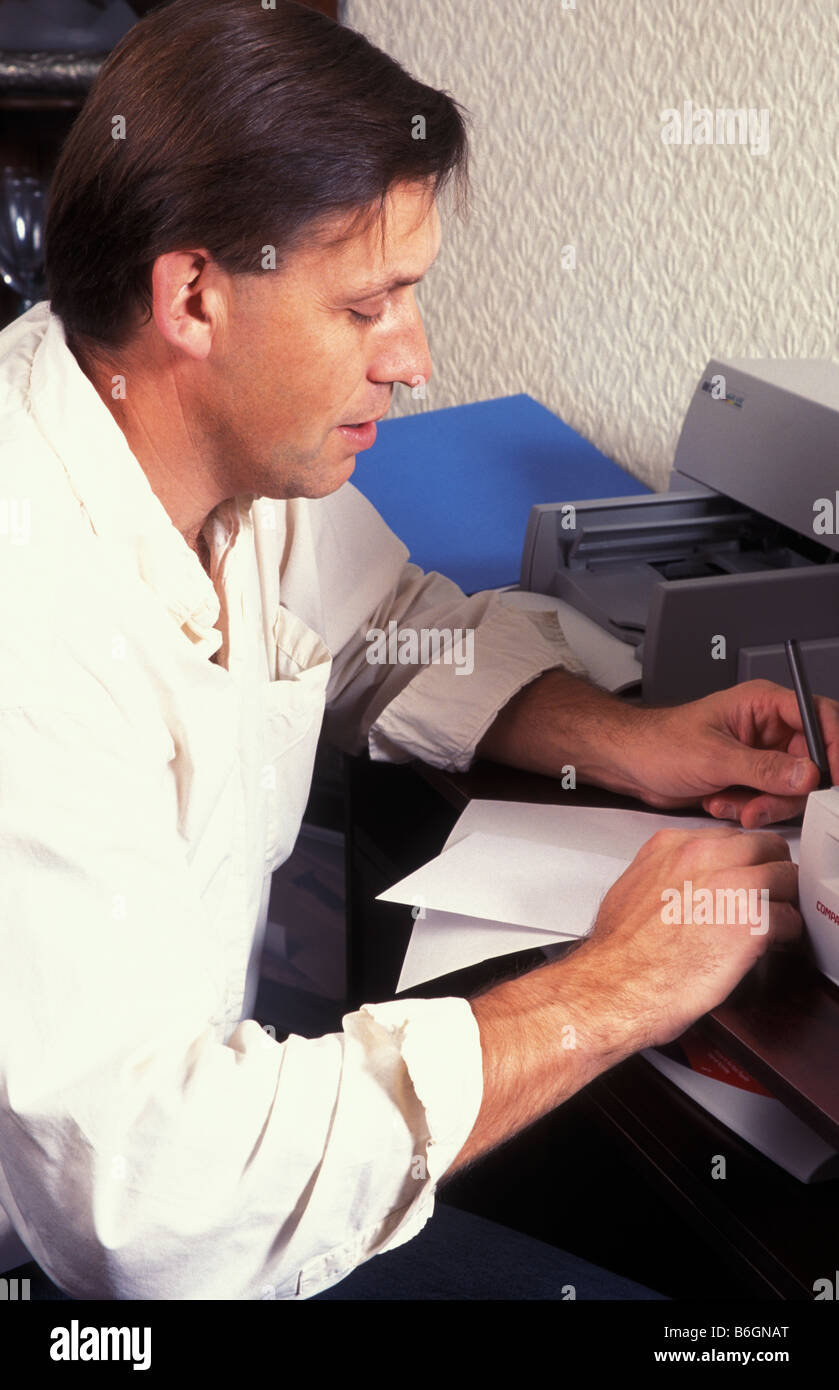 contemplative man writing a letter Stock Photo - Alamy