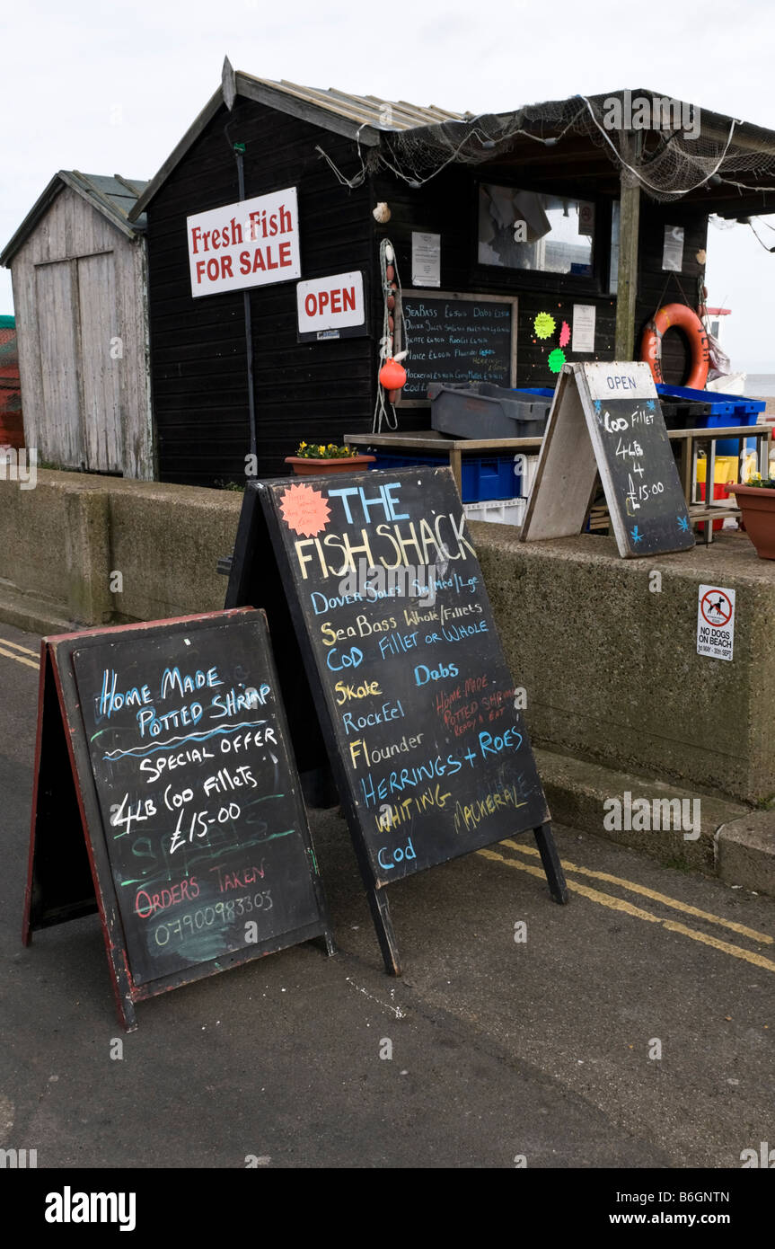 Signs outside a fish sellers stall on the seafront at Aldeburgh Stock ...