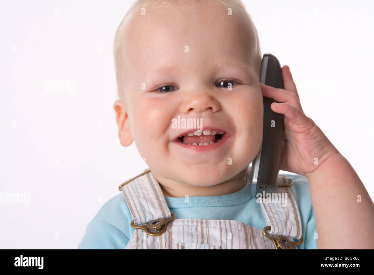 Toddler talking in the phone Stock Photo - Alamy