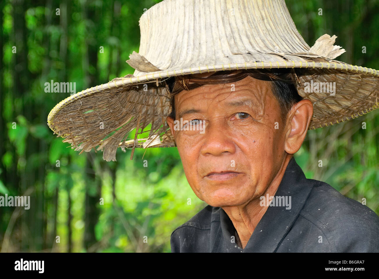 Portrait of a Thai farmer Stock Photo - Alamy