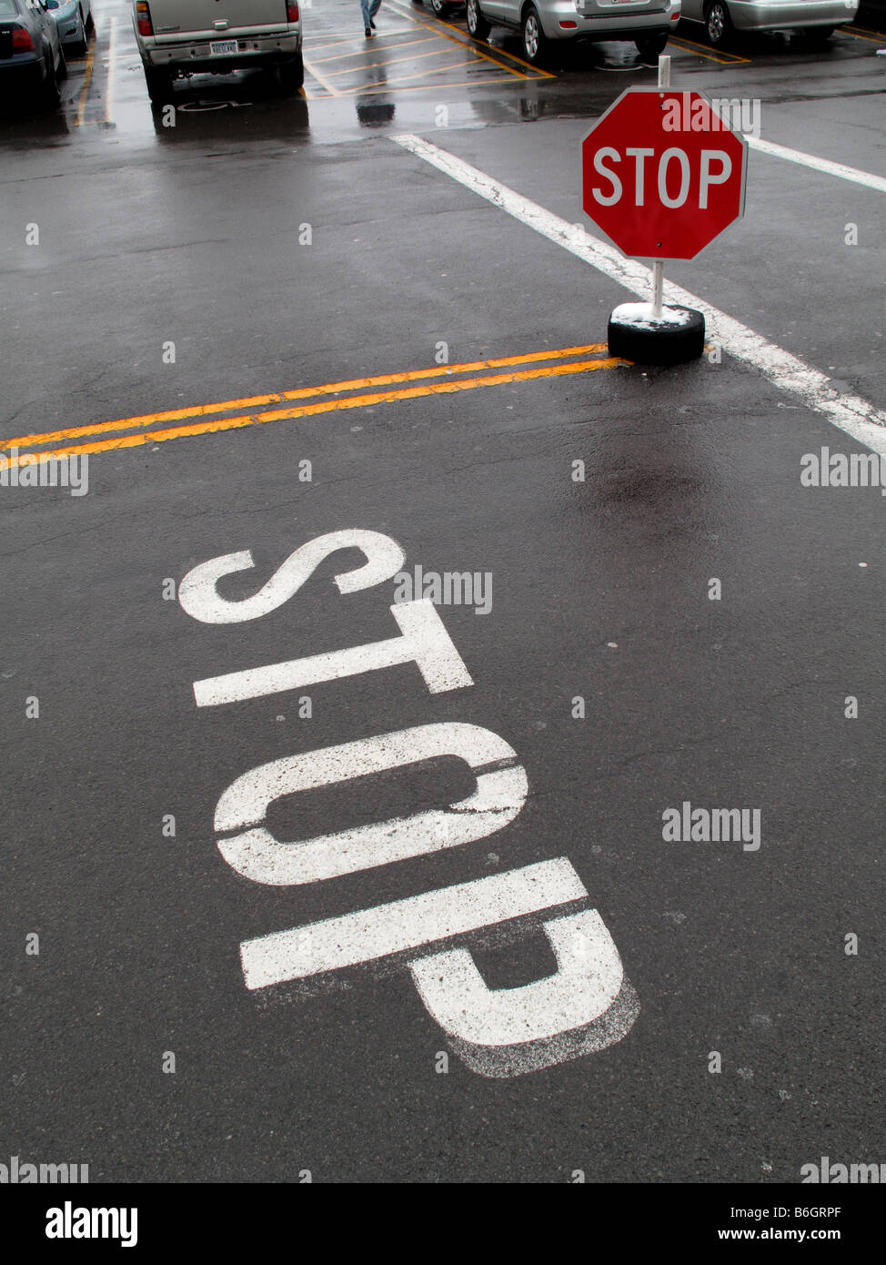 Stop sign at mall parking lot Stock Photo - Alamy