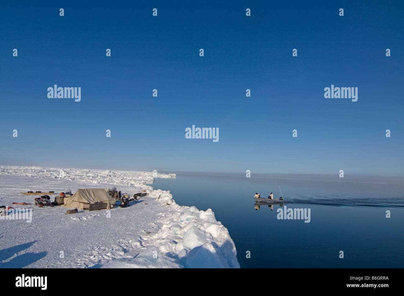 Inupiaq whaling camp at the edge of an open lead in the pack ice ...