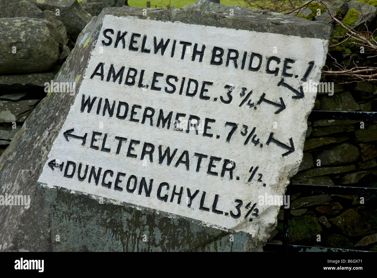 Old stone sign by roadside near Elterwater, Lake District National Park ...
