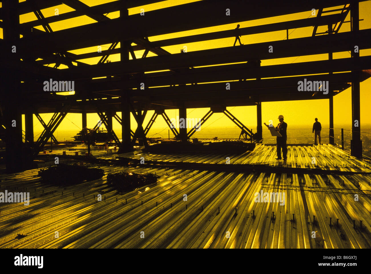 High Rise Building under construction, steel workers, walking on steel ...