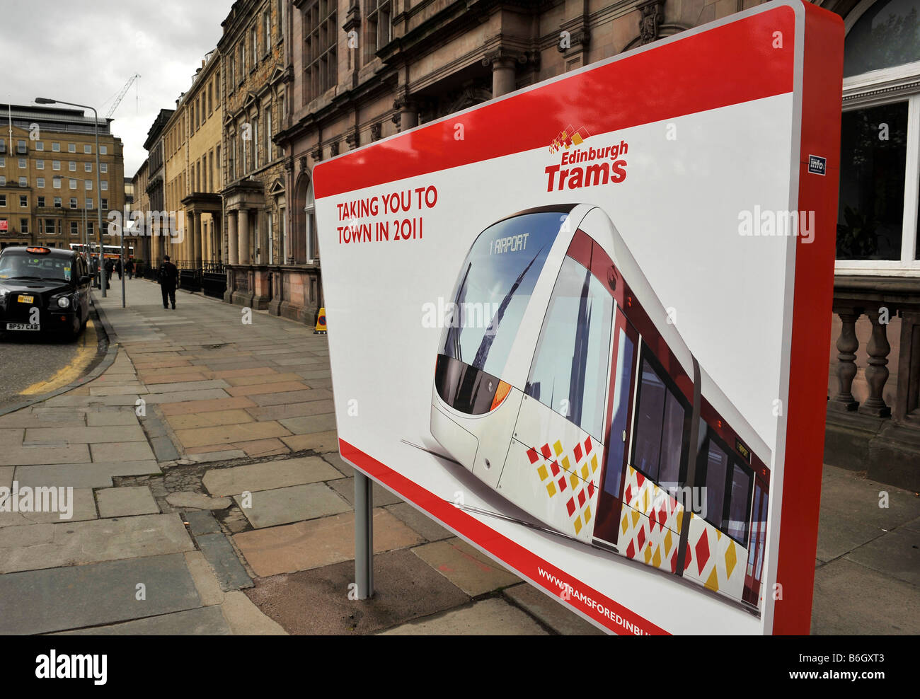 Sign for Edinburgh trams with Taxi cabs in background Stock Photo - Alamy