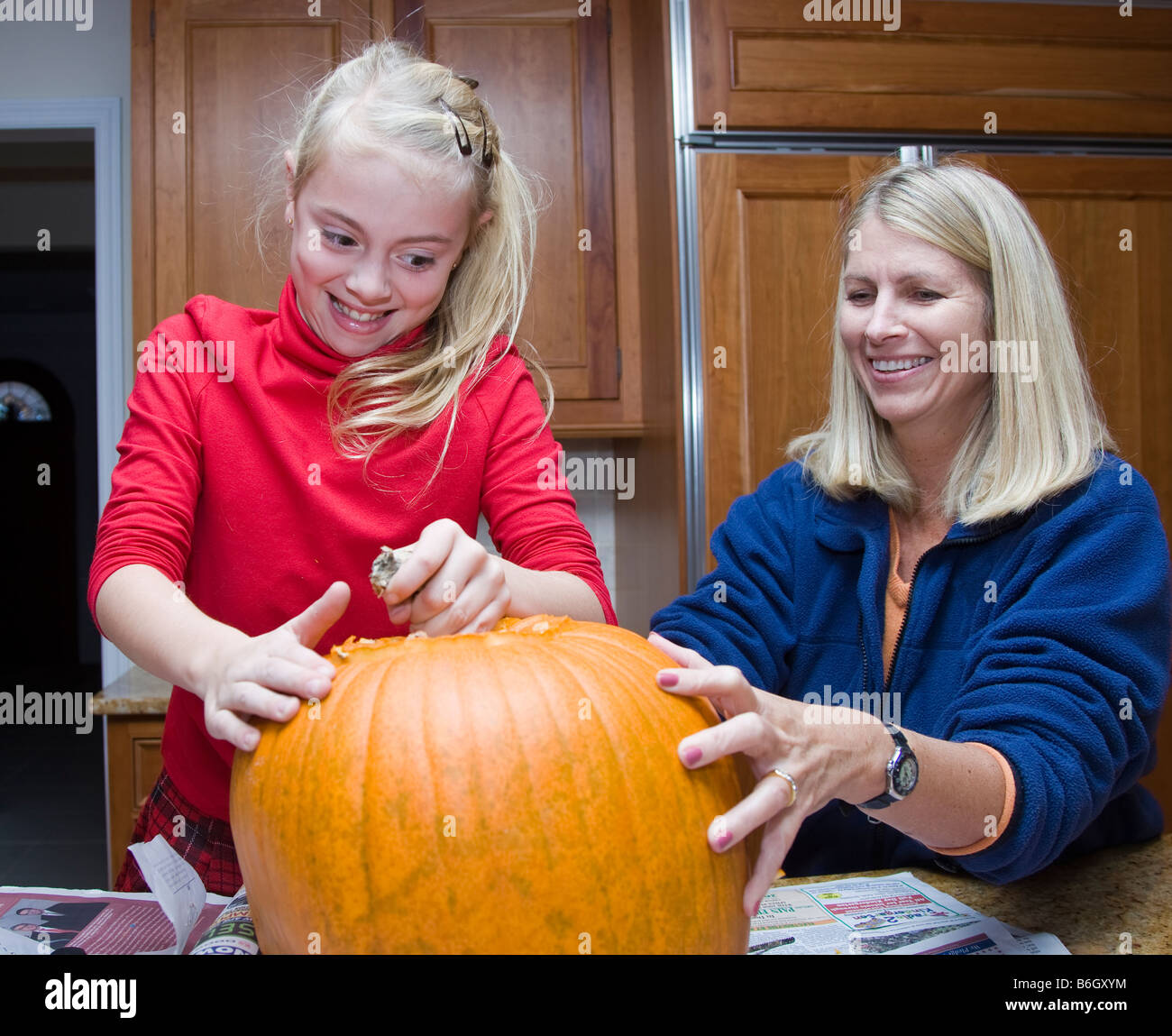 Child pulling the stem off a pumpkin Stock Photo - Alamy