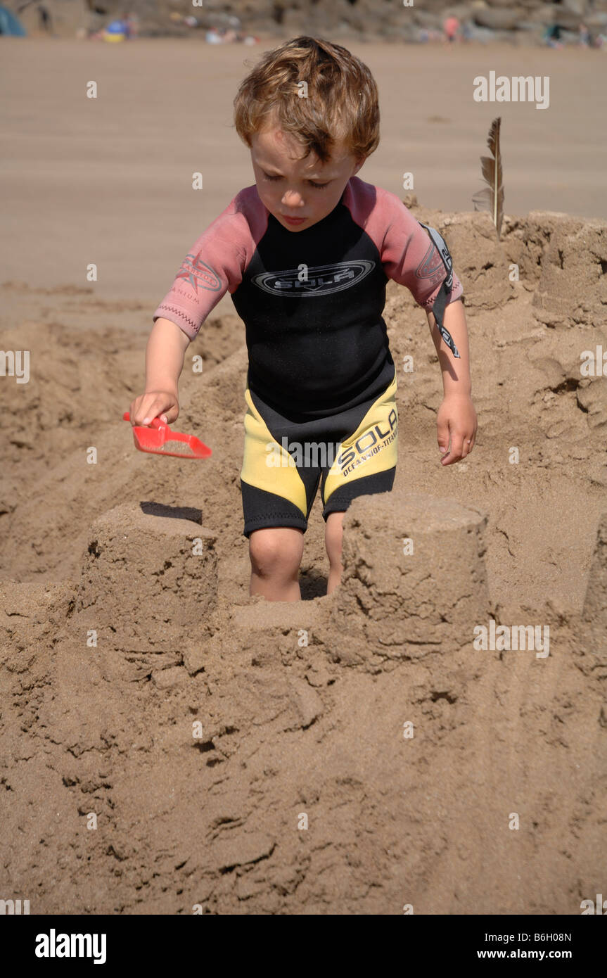 Child playing sandcastle on Marloes Sands Pembrokeshire Wales United ...