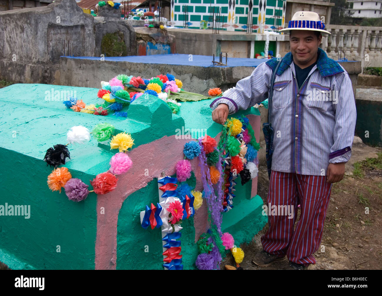 Man in traditional clothing paying homage to his grand-parents on the ...