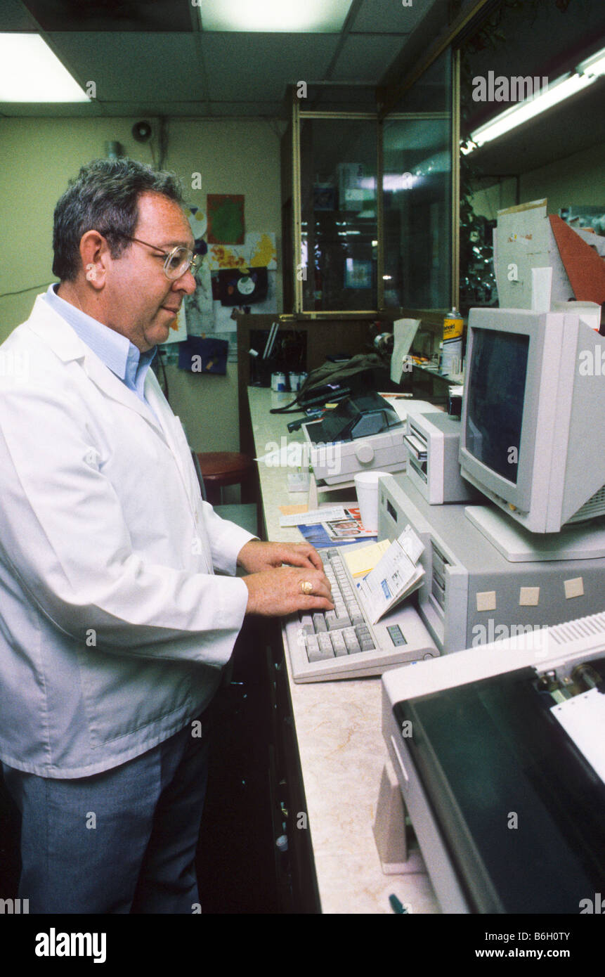 Technician uses computer workstation hi-res stock photography and ...