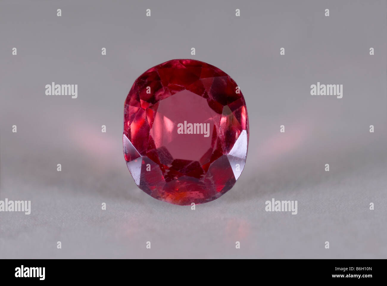 Red Spinel gemstone, large, on stone background Stock Photo - Alamy